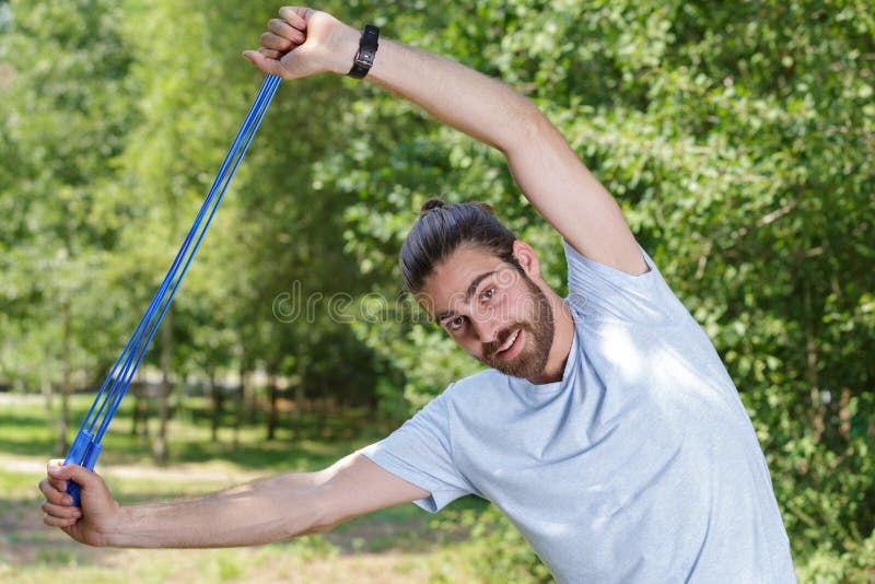Man Doing Stretching with Rubber Band Stock Photo - Image of spring ...