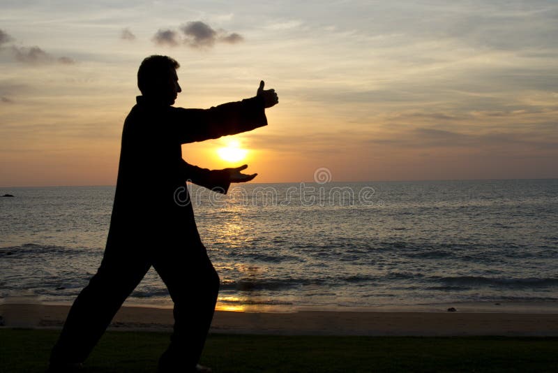 Sunset Tai Chi on a beach stock photo. Image of sand, harmony - 4761916