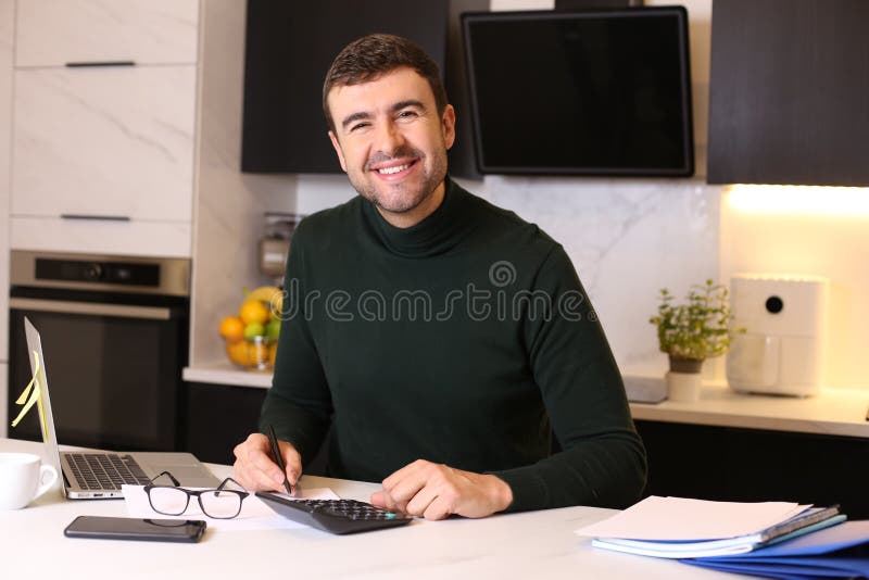 Man doing taxes at home stock photo. Image of caucasian - 263332066