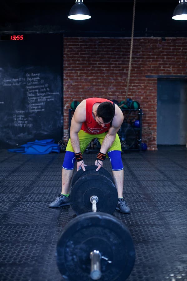 Man doing workout in a gym stock photo. Image of athlete - 91592890