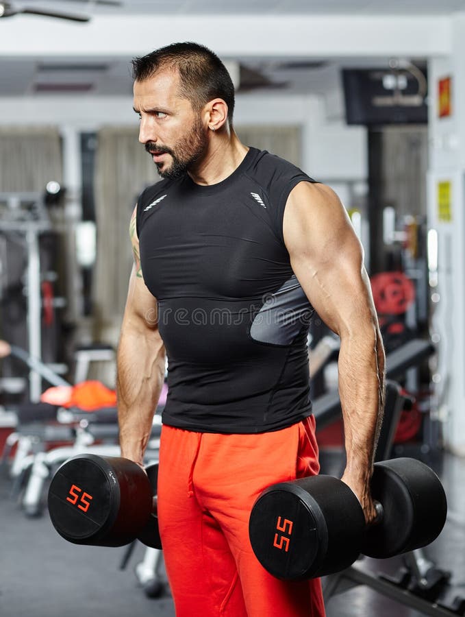 Man Doing Workout with Heavy Dumbbells Stock Photo - Image of equipment ...