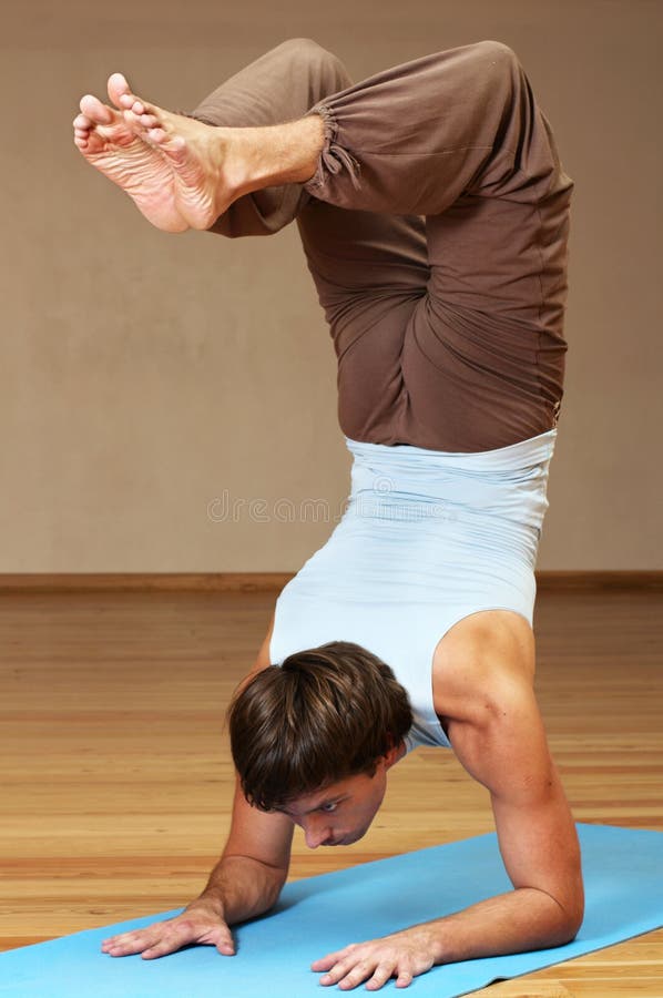 Man doing yoga stock image. Image of indoor, moving, caucasian - 13060791