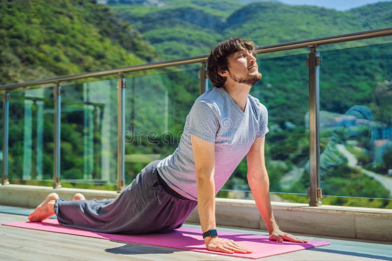 Man Doing Yoga Outdoors on a Rooftop Terrace Stock Image - Image of ...