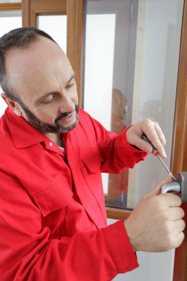 Man during Door Lock Repair Stock Image - Image of close, handle: 160147345