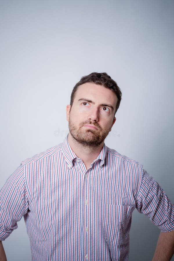 Man with Doubtful and Skeptic Face Stock Photo - Image of idea, looking ...
