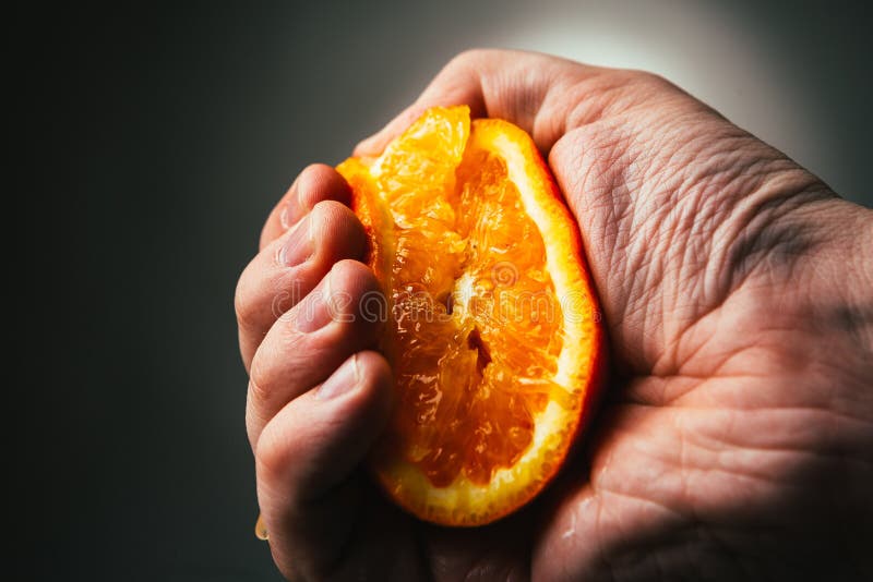 Man Dramatic Squeezes Orange. Conceptis Tired from Work. Stock Image ...