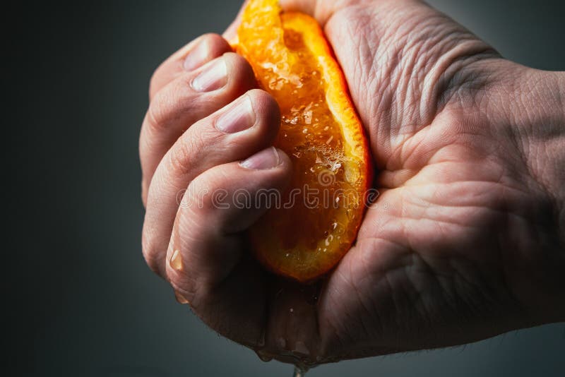 Man Dramatic Squeezes Orange. Conceptis Tired from Work. Stock Image ...