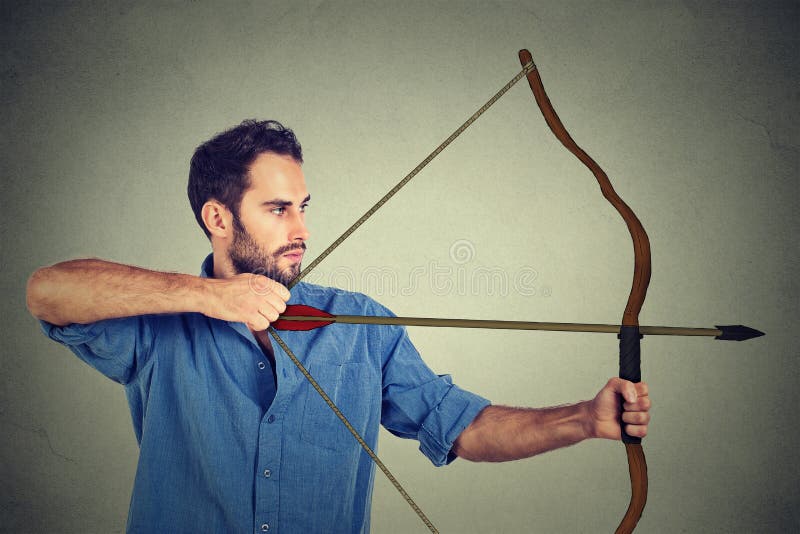 Man drawing a bow stock photo. Image of fire, concentration - 63631280