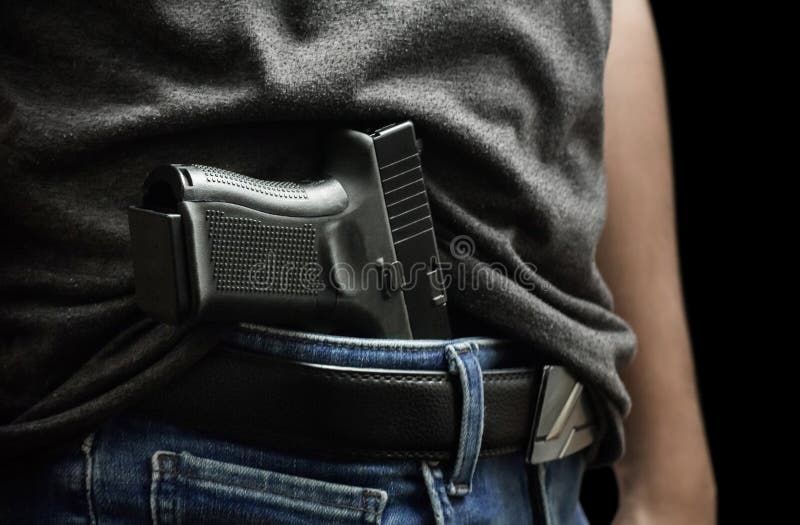 Man Drawing a Conceal Carry Pistol from a Holster Stock Image - Image ...