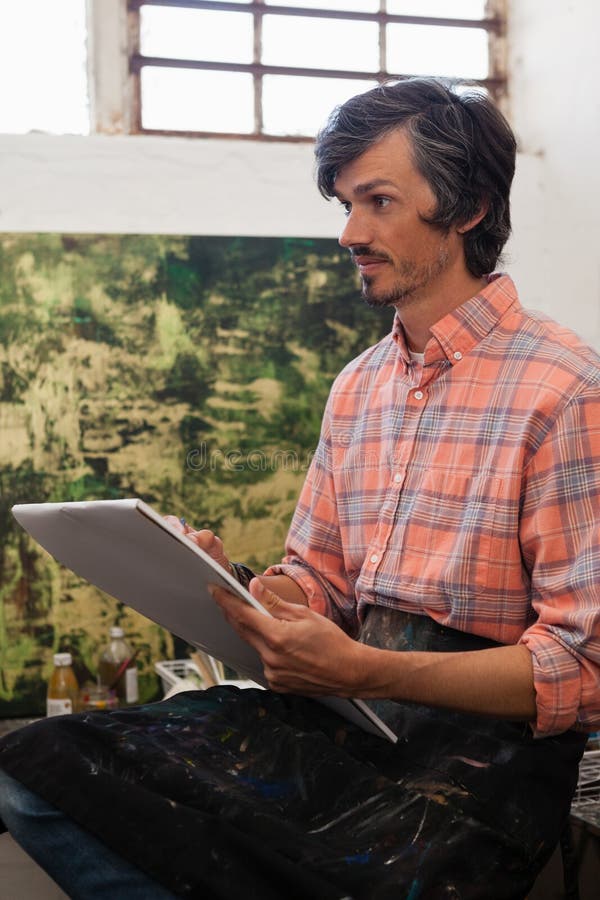 Man Drawing a Portrait in Drawing Book Stock Image - Image of modern ...