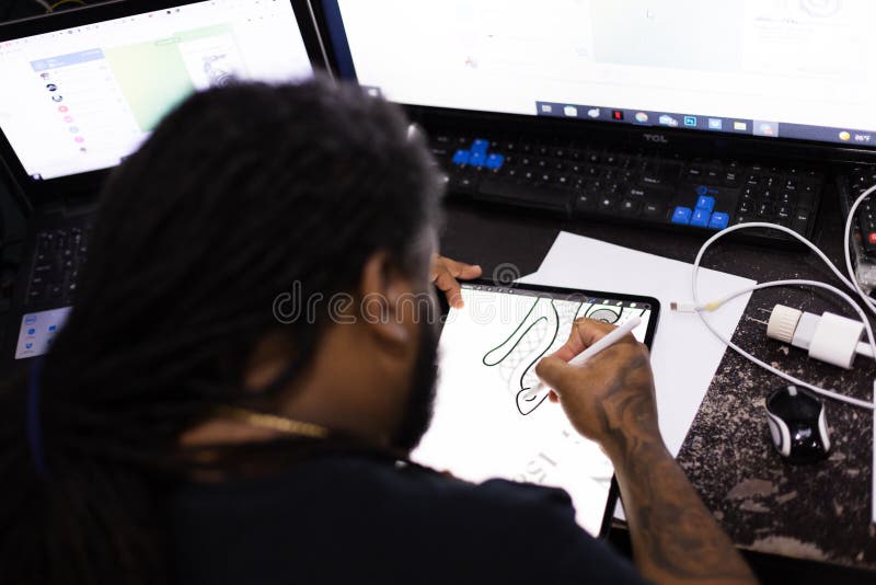 Man Drawing on a Tablet. Rear View. Selective Focus. Stock Photo ...