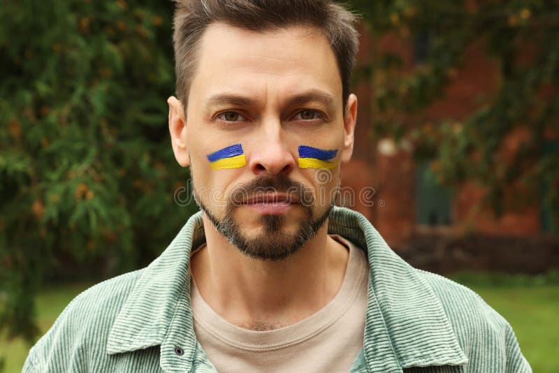 Man with Drawings of Ukrainian Flag on Face Outdoors Stock Photo ...