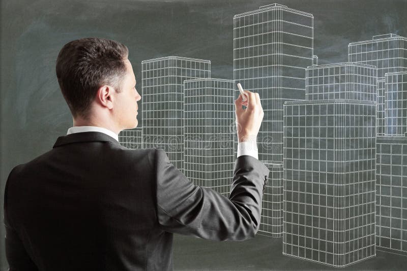 Man Draws Architectural Design of Buildings on Blackboard Stock Photo ...