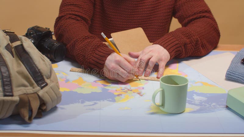A Man Draws on a Map on a Ruler. Close Up Stock Photo - Image of ...