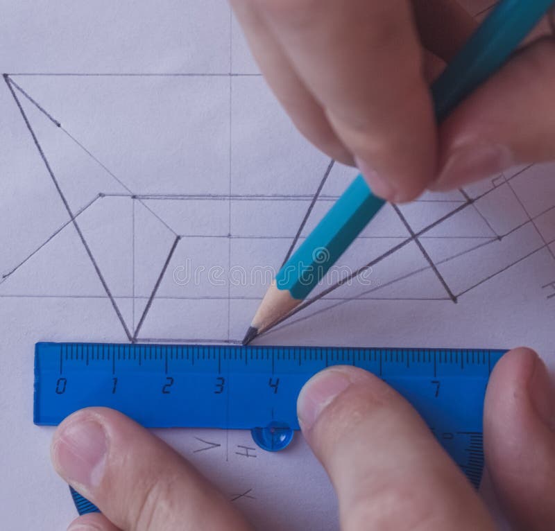 A Man Draws a Scheme on White Paper with a Pencil Using a Ruler. Stock ...