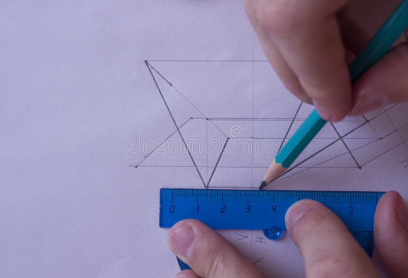 A Man Draws a Scheme on White Paper with a Pencil Using a Ruler. Stock ...