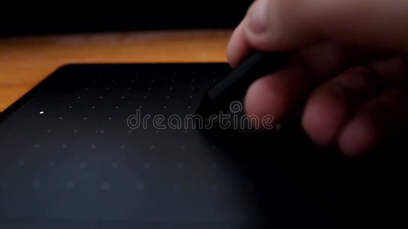 A Man Draws and Works at a Computer Using a Graphics Tablet, Close-up ...