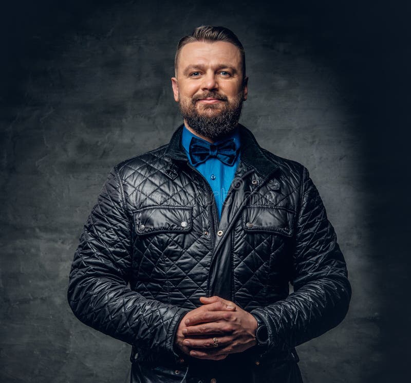 A Man Dressed in a Leather Jacket and Bow Tie. Stock Image - Image of ...