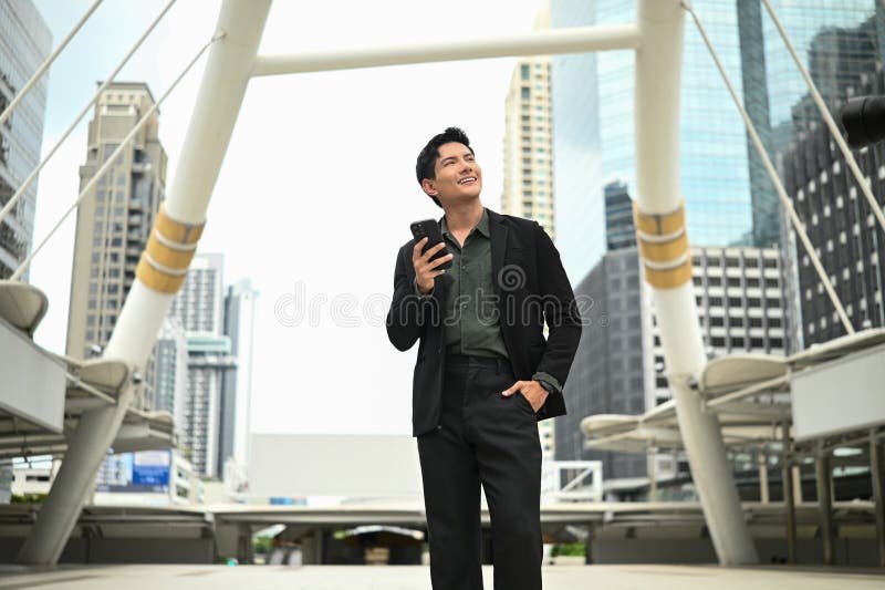 Tall Cell Phone Antenna Tower Next To Small Building Situated on Top of ...