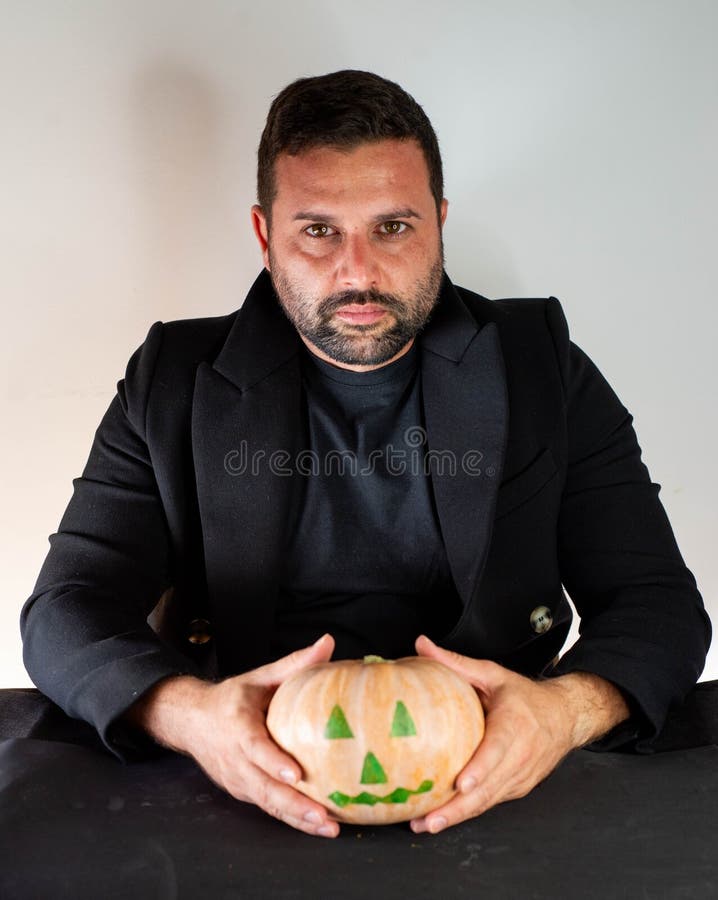 Man Dressed Up for Halloween with a Pumpkin in His Hand Stock Photo ...