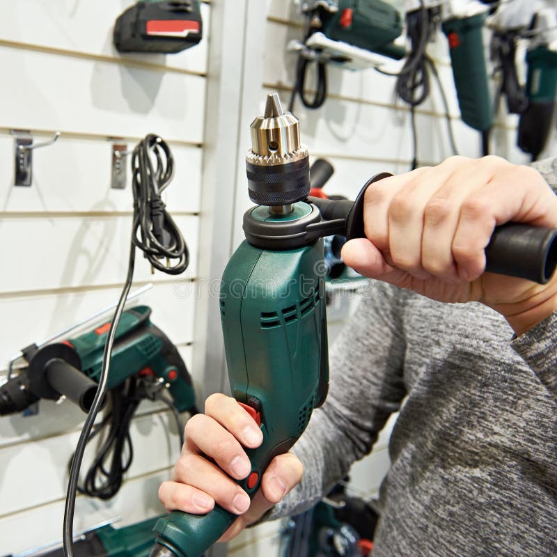 Man with Drill in Hardware Store Stock Image - Image of homework, drill ...