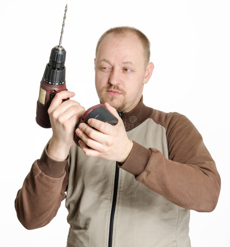 Man with drill machine stock image. Image of confident - 29385077