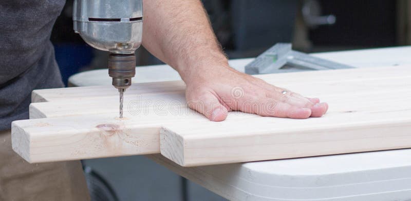 Man Drilling a DIY Project stock image. Image of construction - 137447563