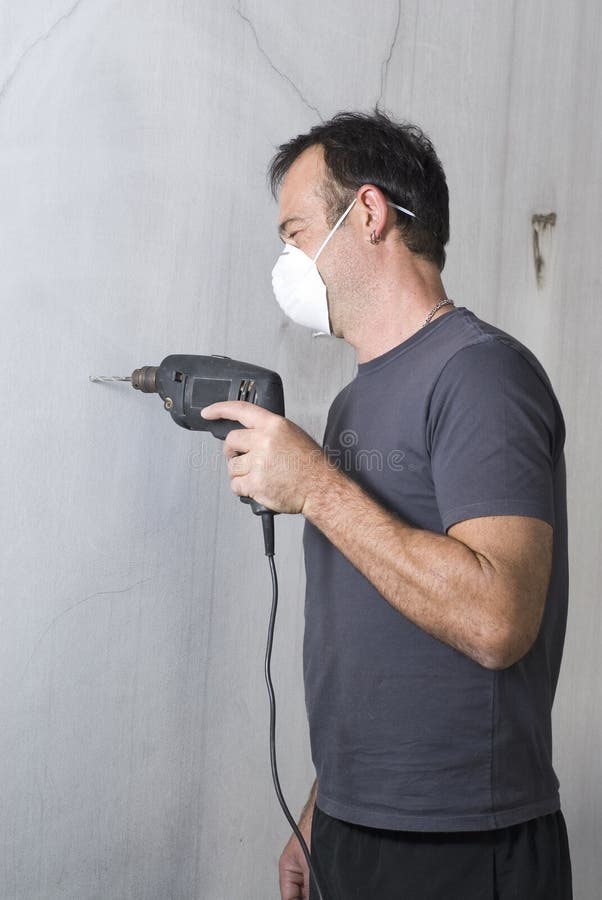 Man Drilling Hole - Vertical Stock Image - Image of midlife, happiness ...