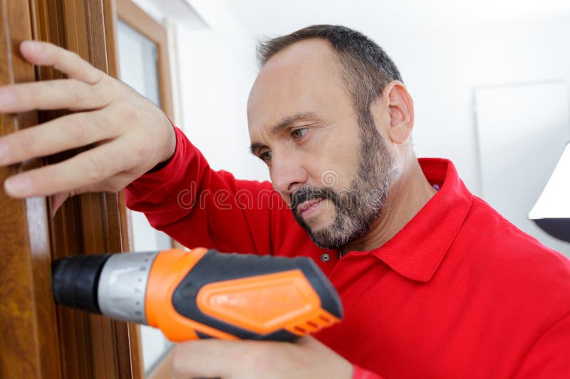 Man Drilling Hole in Window Frame Stock Photo - Image of housework ...