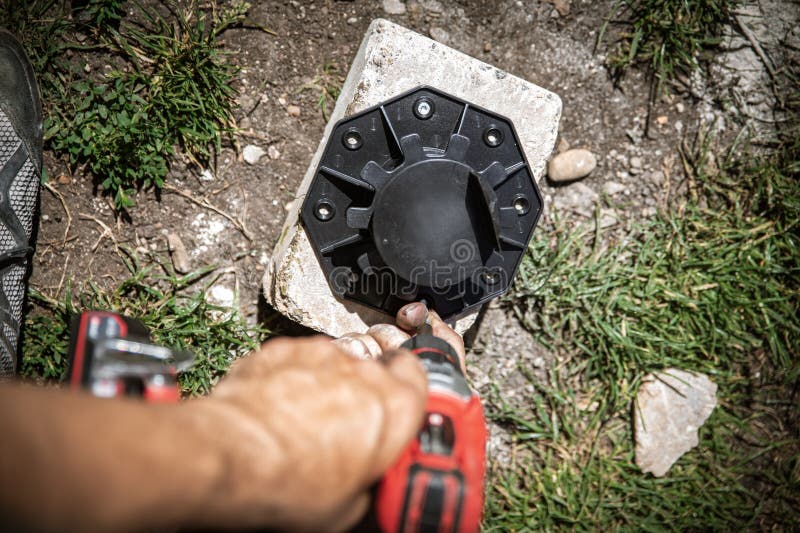 A Man is Drilling Holes for Dowels in Stone or Concrete Stock Photo ...