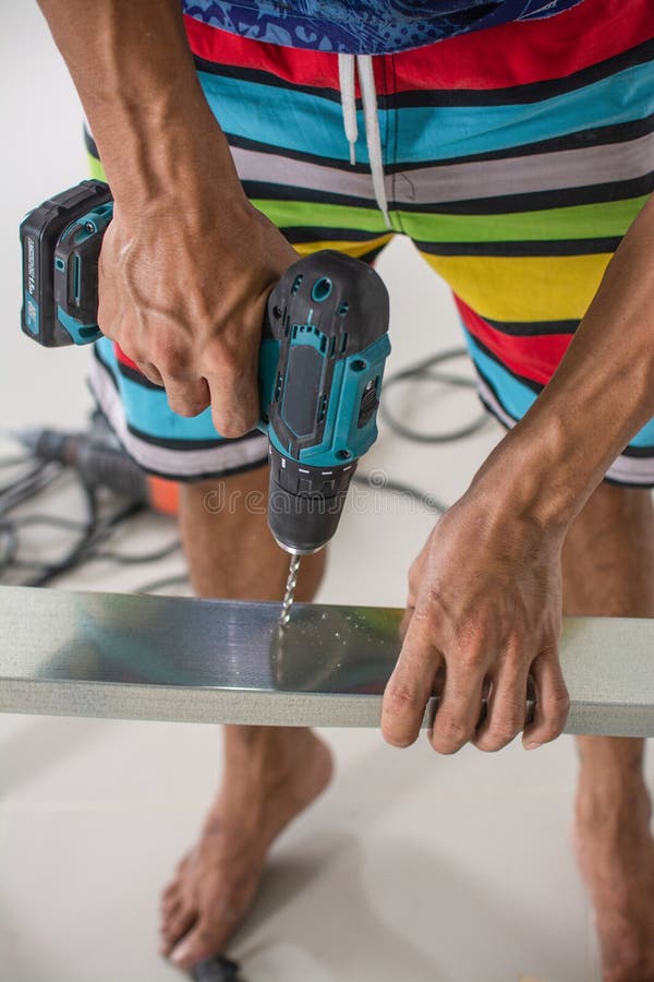 Man Drilling Square Steel Bar Stock Photo - Image of manufacturing ...