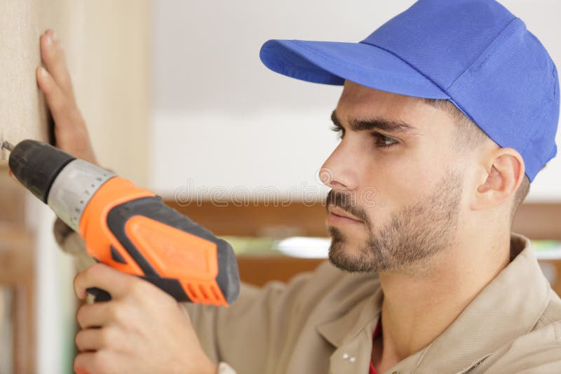 Man Drilling Wall with Drill Perforator Stock Photo - Image of holding ...