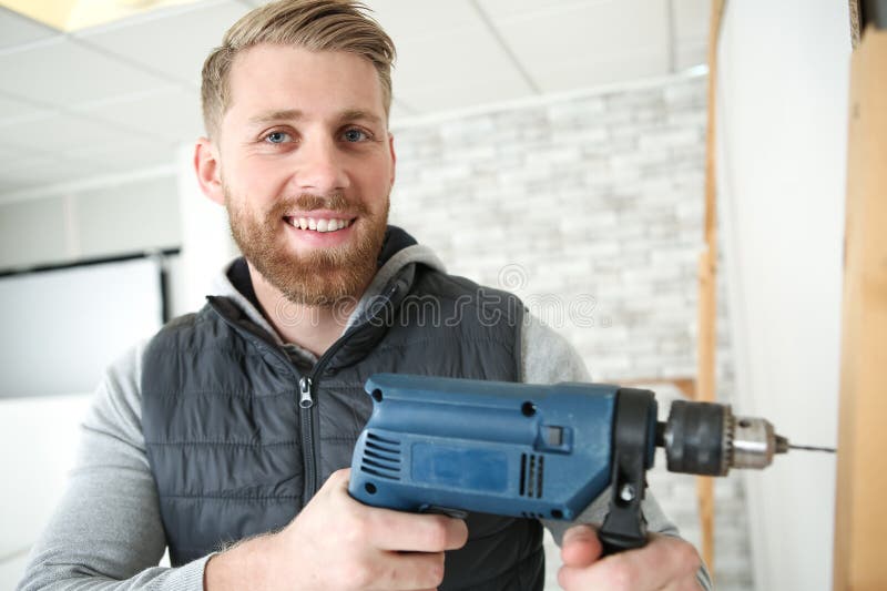 Man Drilling Wall with Drill Perforator Stock Photo - Image of person ...