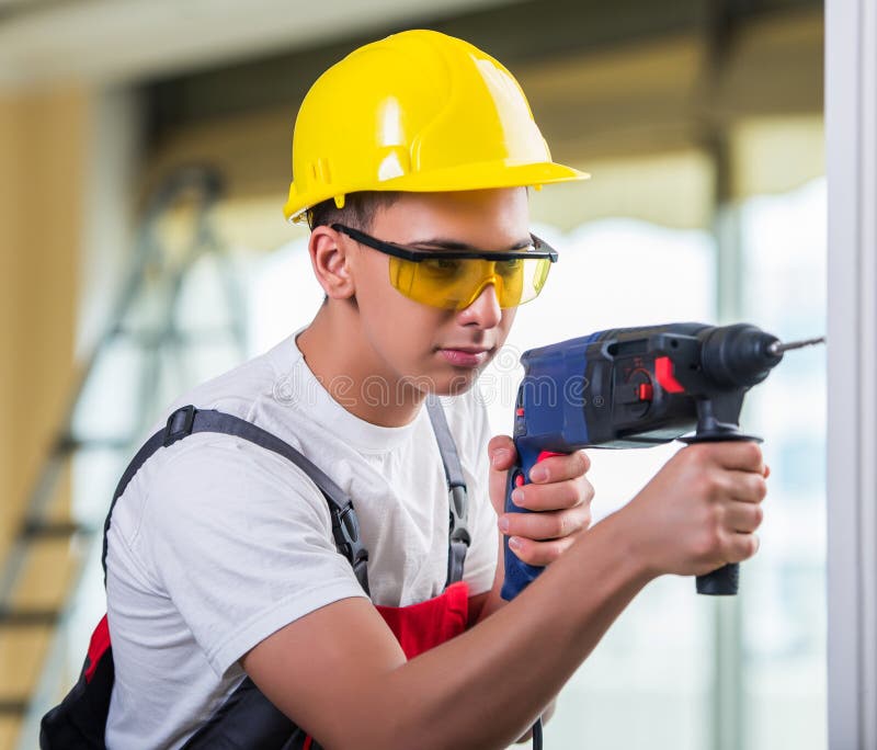 Man Drilling the Wall with Drill Perforator Stock Photo - Image of ...