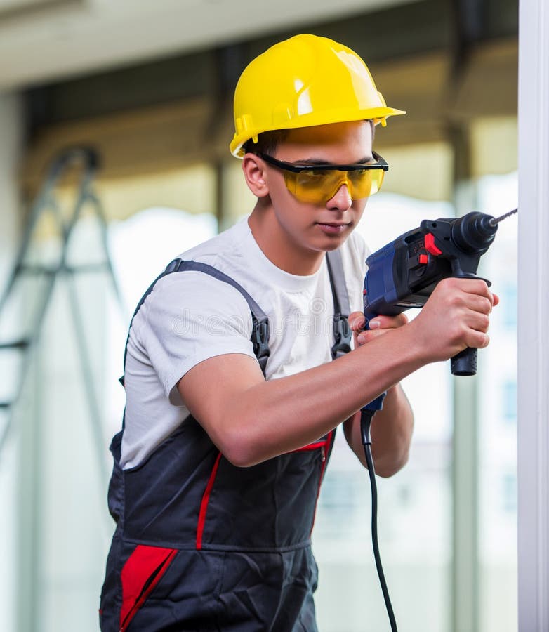 Man Drilling the Wall with Drill Perforator Stock Photo - Image of ...