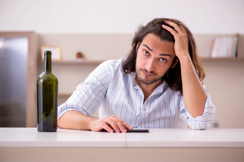 Young Man Drinking Alcohol at Home Stock Photo - Image of drunkard ...