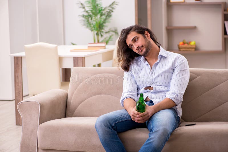 Young Man Drinking Alcohol at Home Stock Image - Image of drunk ...
