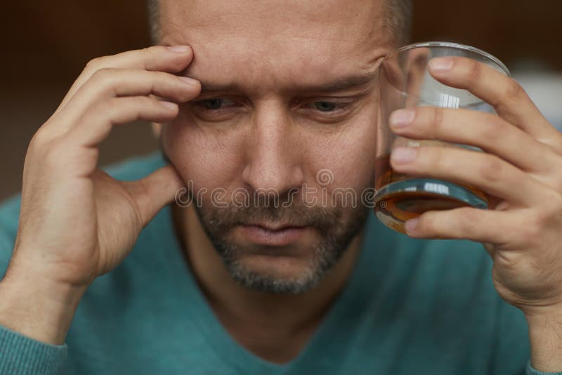 Man drinking alcohol stock image. Image of serious, looking - 175536615