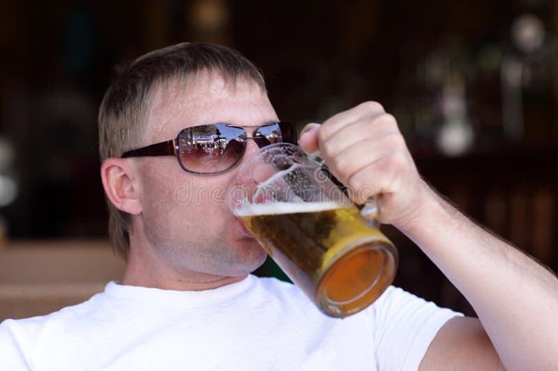 Man drinking beer stock photo. Image of hold, drinking - 27038036