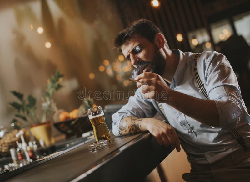 Man Drinking Beer and Smoking Cigarette at Pub Stock Photo - Image of ...