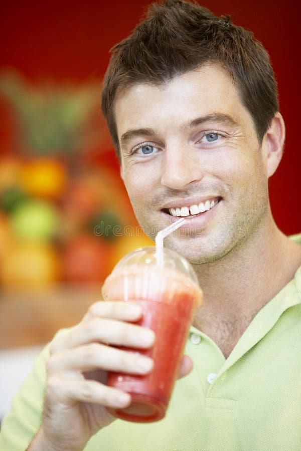 Man Drinking a Berry Smoothie Stock Image - Image of caucasian, color ...