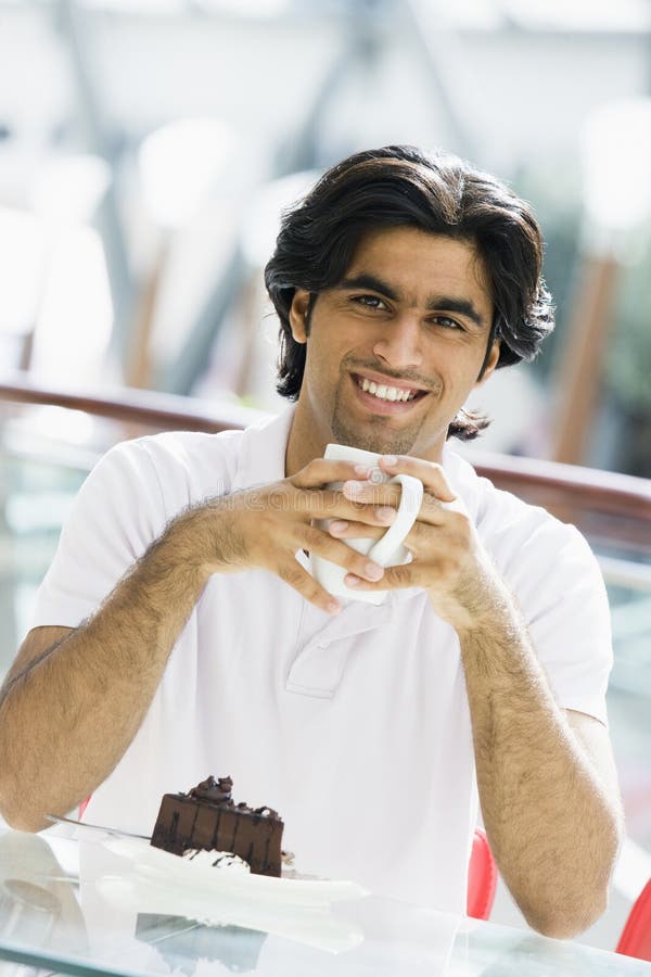 Man Drinking Coffee in Cafe Stock Photo - Image of eastern, middle: 5210186