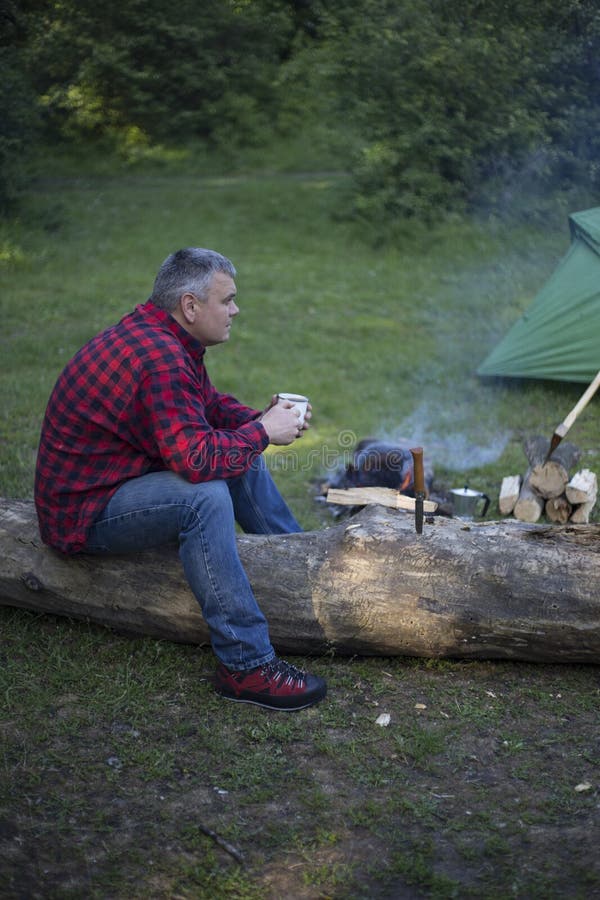 Man Drinking Coffee by the Fire. Stock Image - Image of camping ...