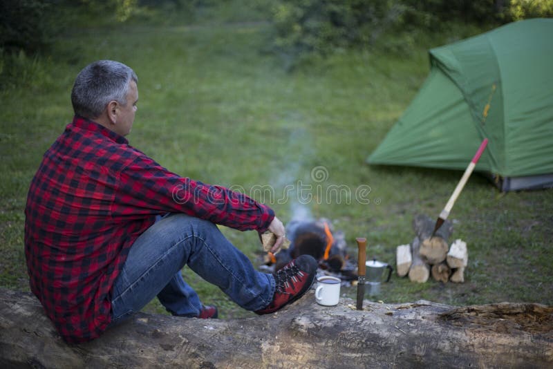 Man Drinking Coffee by the Fire. Stock Photo - Image of alone, drink ...