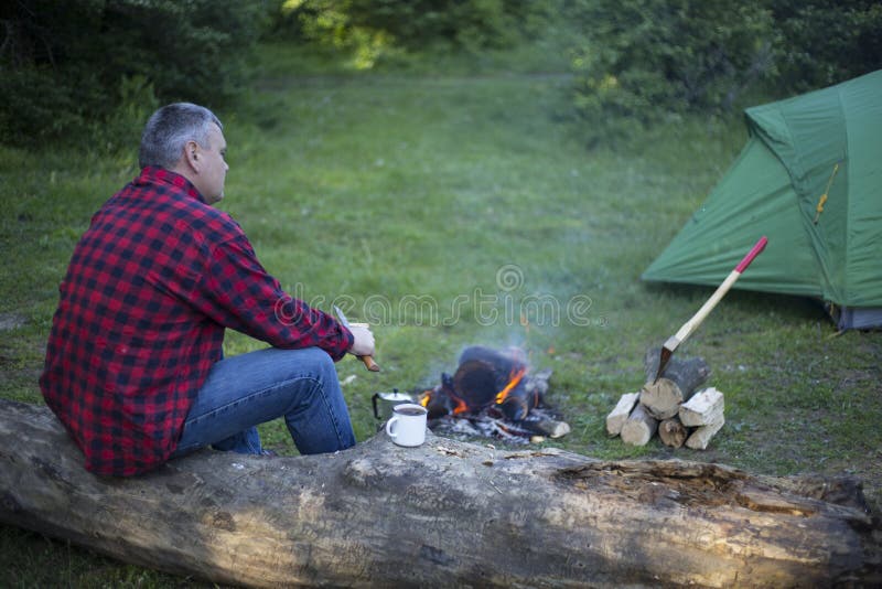 Man Drinking Coffee by the Fire. Stock Photo - Image of healthy, dishes ...