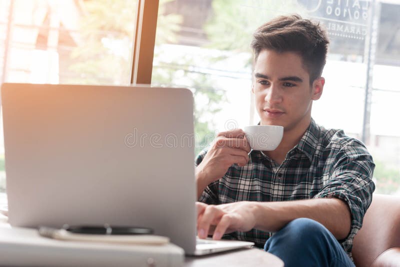 Man Drinking Coffee with Laptop on Wooden Table Stock Image - Image of ...