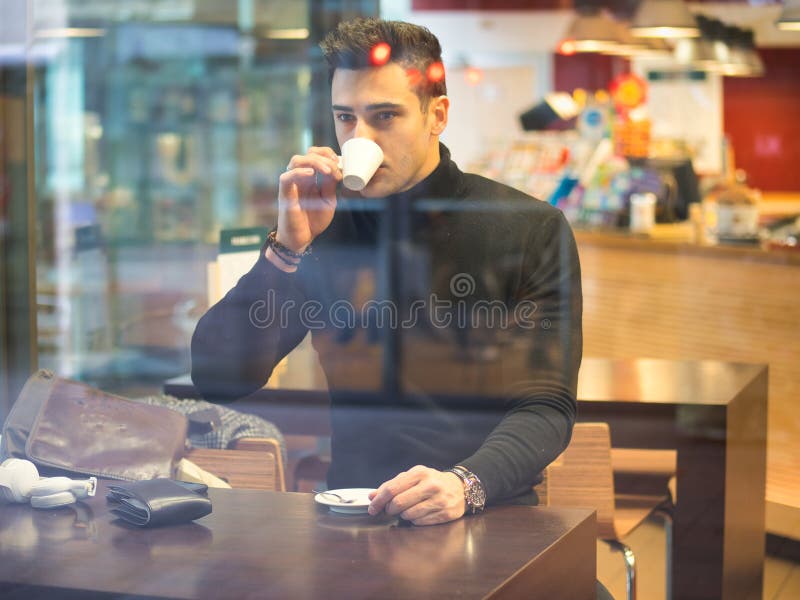 Man Drinking Coffee from Outside of the Bar Window Stock Image - Image ...