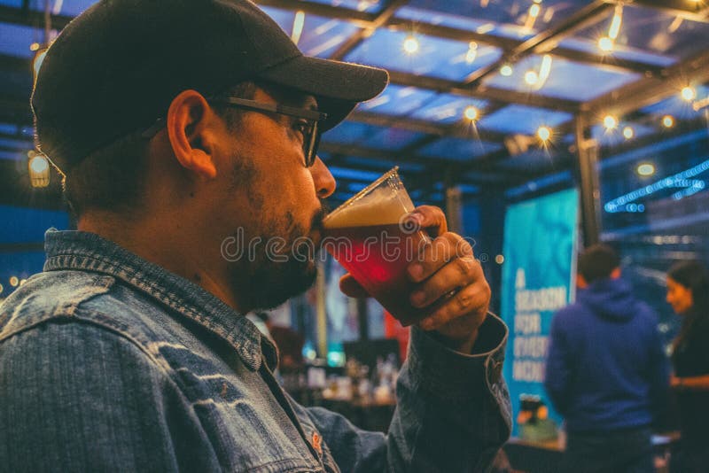 A man drinking craft beer editorial stock photo. Image of craft - 172977023