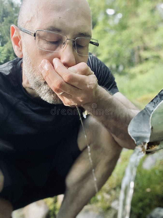 Man Drinking Forest Stream Water Stock Image - Image of running ...