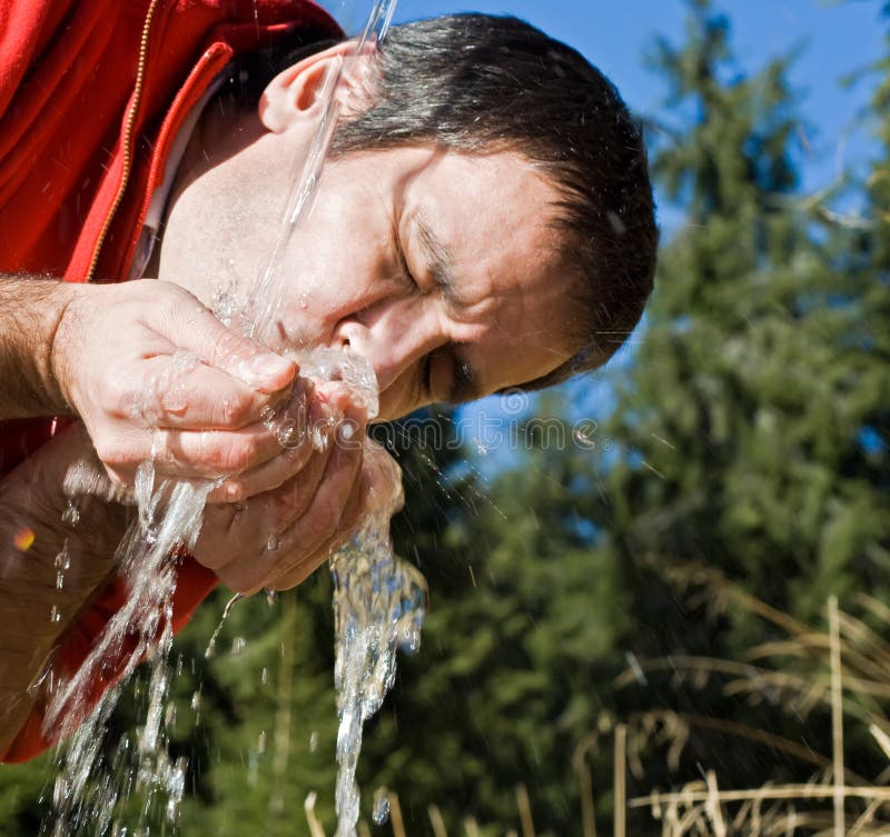 Man drinking fresh water stock image. Image of cool, blue - 13277057